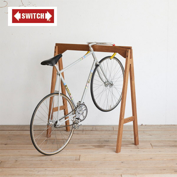 木目の美しいオーク材と色合いが、存在感のあるお洒落なスウィッチバイクスタンド。高さはロードバイクを出し入れしやすい高さです。上部にアールをつけることで大事な自転車を傷つけにくくしています。このラックにロードバイクをかけて、ブレーキやワイヤー...