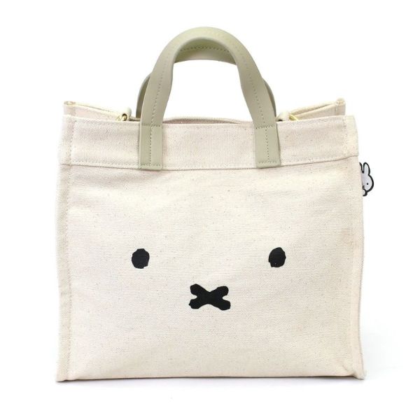 [型番:1702-695757]側面のひょっこりネームがかわいい♪ミッフィーのおかお2Wayトートバッグです。持ち手は合皮の異素材ミックス。付属のショルダーを付ければトートバッグになります！マグネットホックで中身が見えなくて安心☆両側に内ポ...