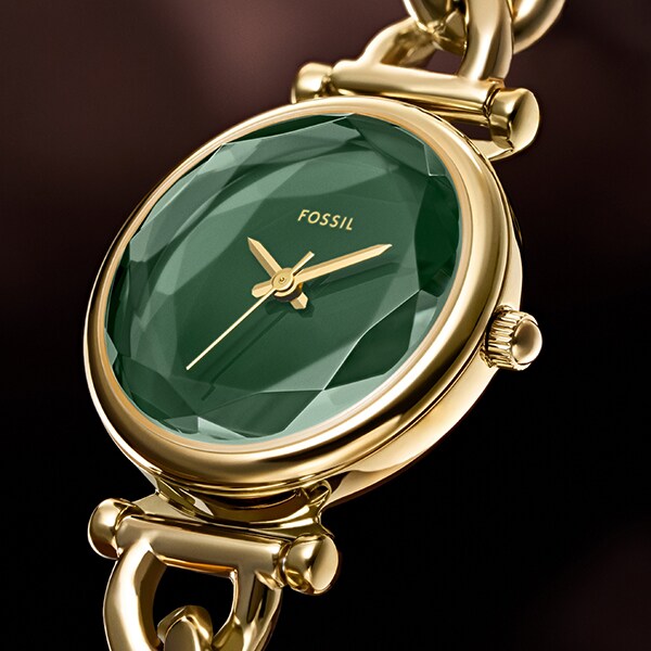 [型番:ES5441]ゴールドトーンのステンレススチール製ブレスレットがゴールドトーンのラウンドケースを引き立て、まとまりのある洗練されたルックを生み出します。光沢のあるグリーンのダイヤルは、リッチでなめらかな仕上げで深みを加え、洗練された...