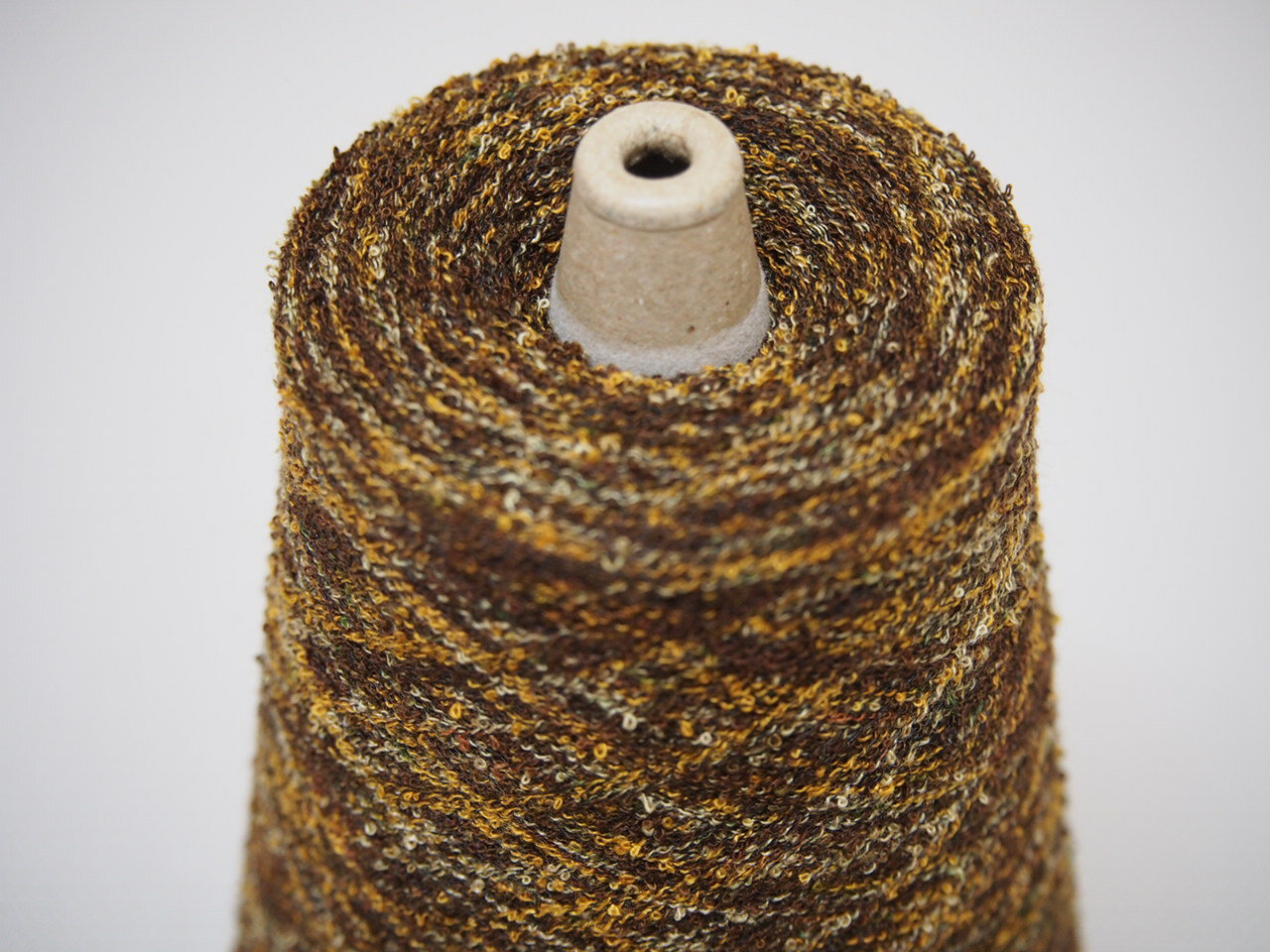 毛糸・手編み糸・織り糸　手芸糸の激安通販なら【糸屋.com】 合繊カスリブークレ 　コレット　411　200g巻　 日本有数のニット素材製造販売会社の規格・製造品細番手の ブークレにカラフルな絣を施し、織り糸・合せ糸に最適な 29番手の超極...