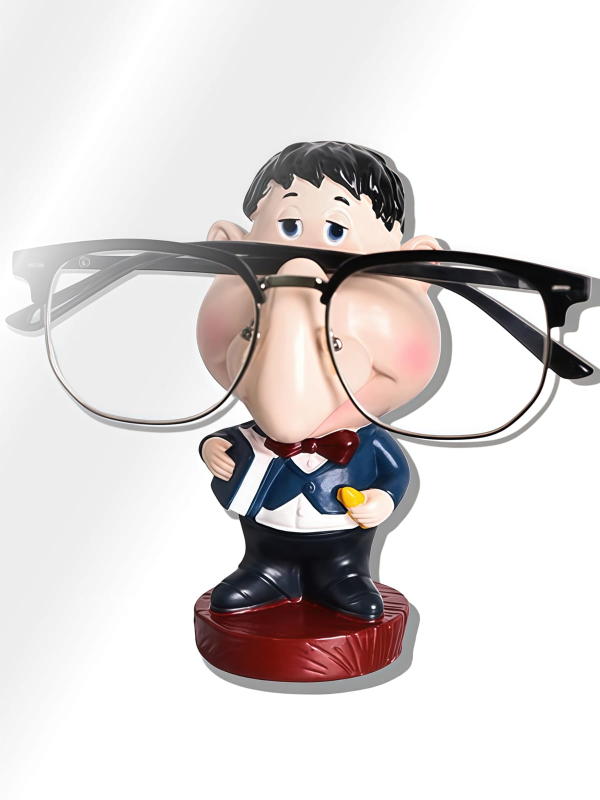 【サイズ】：奥行き8cm×横6cm×高さ13cm 【重さ】：約65g 【材質】：合成樹脂(生産国：中国) 【機能・用途】：メガネスタンド、眼鏡置き【ユニークなデザイン】：優しくコミカルで かわいい 垂れ目の せんせい があなたのメガネを顔で...