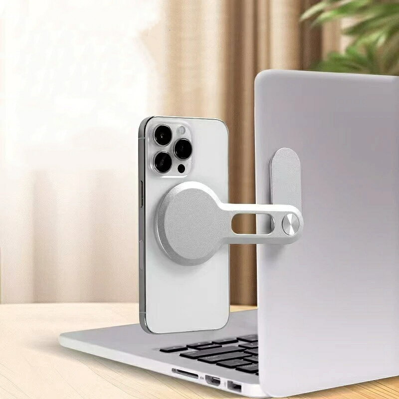 ノートパソコンのディスプレイ背面に取り付けるマグネット式スマホスタンドです。アーム部分が回転し、スマホをノート PC の横に並べて設置可能。スマホとパソコンの**デュアル画面**で同時作業ができ、資料閲覧チャット確認動画視聴など、仕事の効率...