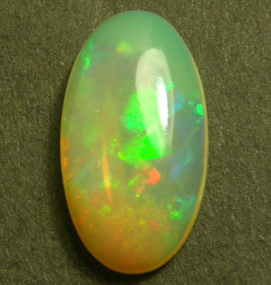 宝石名 天然オパール 産地 　アフリカ産 重さ 3．39ct サイズ 16．6x9．2x4．4ミリ 色 遊色 商品説明 大きなウォーターオパール。 発送 簡易書留郵便も対応しています。重さにより価格変わります。