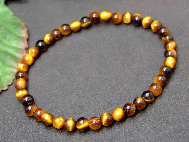 ※画像と同品質のものをお送りします。 オリジナルアクセサリー作りに是非どうぞ〜〜（m−m） ポーチに入れた状態で発送いたしますので、そのままプレゼントとしてご利用頂けます。 素材 天然石：タイガーアイ サイズ 約：重さg　玉径4mm・±0....