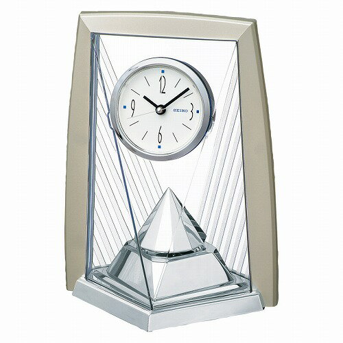 薄金色のフレームの中に時計が浮いているような、シルバーの多角錐形回転飾りを配した近未来的なモデル。○クオーツ時計 ○スイープ秒針 ○一方向回転飾りタイ製 無地箱 プラスチック 本体（約249×185×160mm）×1 約710g 単3×2（...