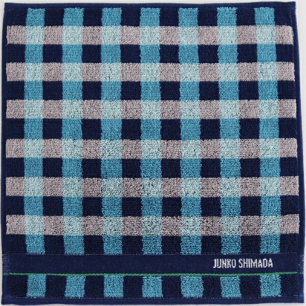 ブロックチェックにジュンコシマダの遊び心あるカラーをアクセントに加えたデザイン。吸水性に優れたタオルハンカチーフです。