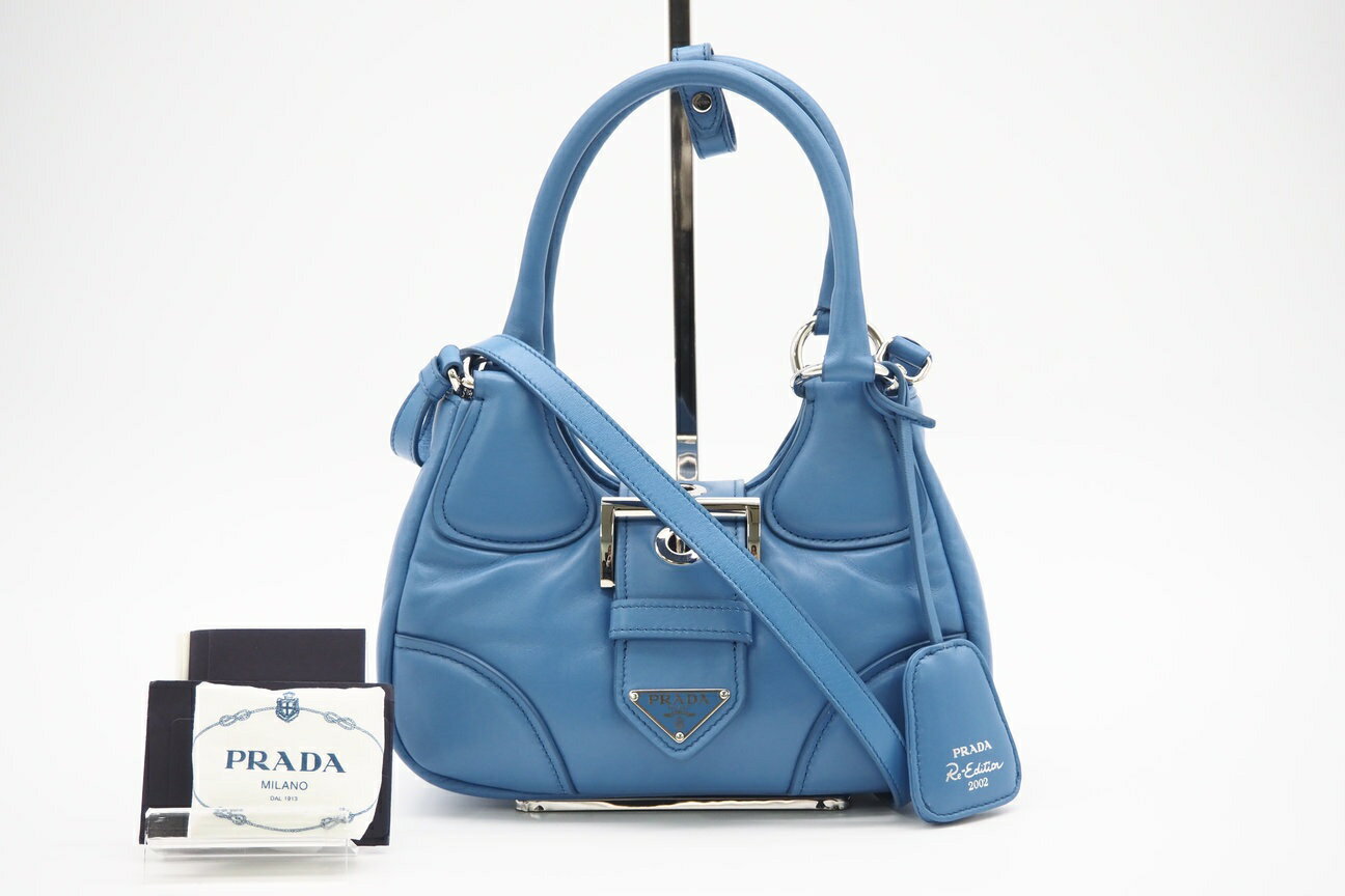■ブランド名 PRADA プラダ ■品名 ナッパソフト ムーン レザー 2WAYハンドバッグ ■シリアル 31 ■型番 1BA381 ■カラー系統 ブルー ■サイズ W約24cm x H約13cm x D約7.5cmハンドル：約35cmショ...