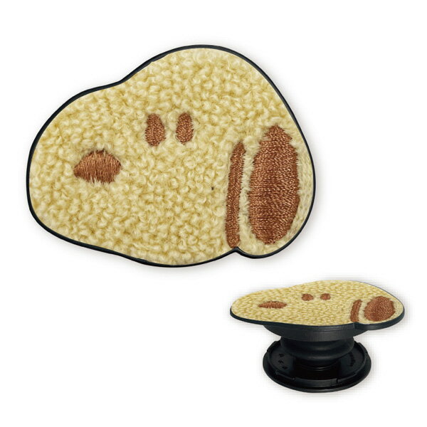 (C) 2021Peanuts Worldwide LLC www.snoopy.co.jp スマートフォンの背面に貼り付けるアクセサリです。 スマートフォンの持ちやすさを向上します。スタンドとしてもご使用いただけます。 使用時：本体上部を...