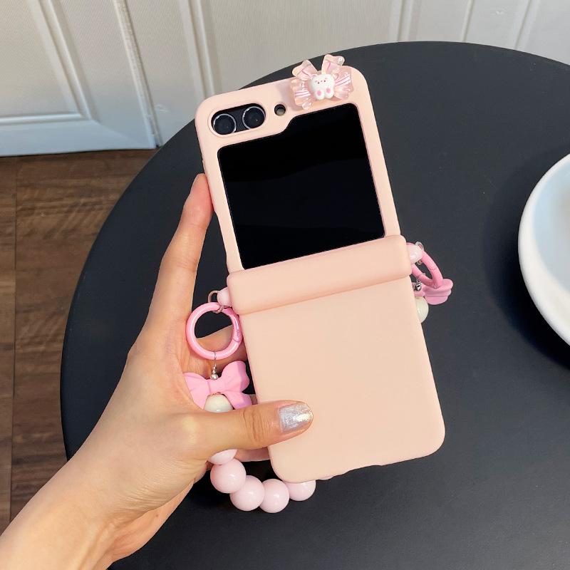 ・ケースタイプ: ハードシェル・素材: PC・装飾: ストラップ・加工: 磨砂・色: ピンク・対応モデル: Samsung Z Flip5, Samsung Z Flip6・スタイル: シンプル・機能: 耐衝撃・対応機種: Samsung