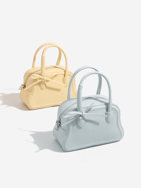 ・カラー: イエロー・素材: ポリウレタン・タイプ: ボストンバッグ・バッグサイズ: 小・装飾: リボン、ステッチ・裏地: ポリエステルコットン・形状: 枕型・開閉: ジッパー・内部ポケット: スマホポケット、カードポケット・硬さ: 中・外...