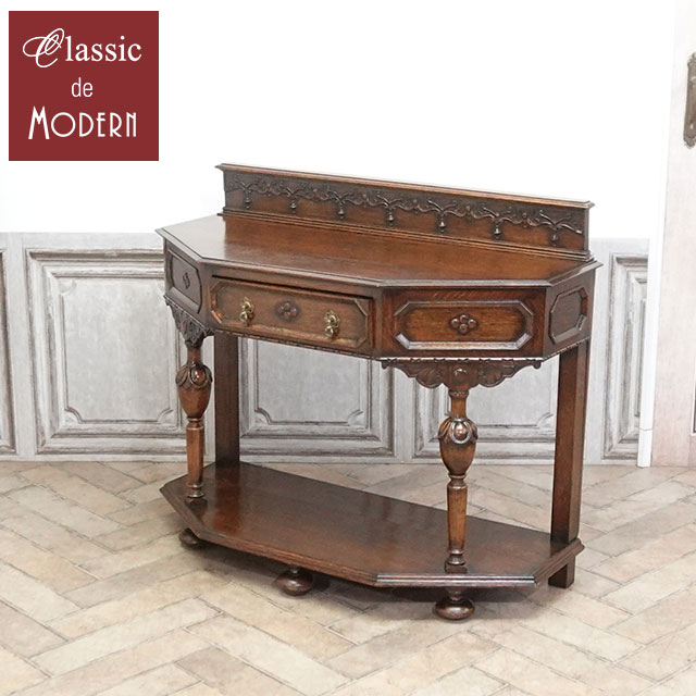品名・品番 antique81082　サイドテーブル　1910年頃　オーク材　イギリス サイズ W 108 x D 46 x H 89 (天板高 76) cm 商品について 気品漂う彫刻が印象的な引き出し付きコンソールテーブルです。 長い年...