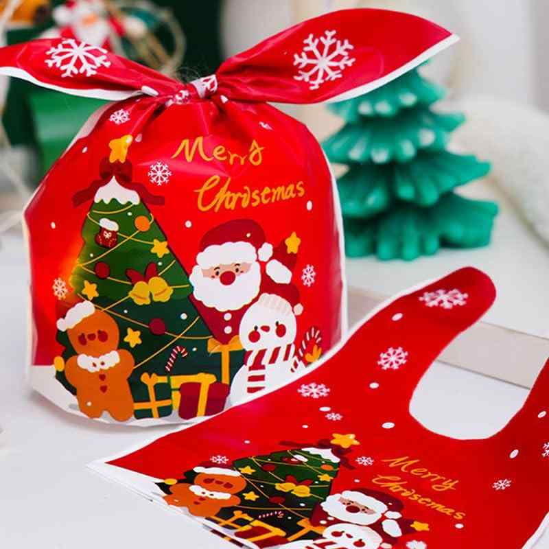 Moeagel クリスマス キャンディーバッグ 40枚入り 可愛い クリスマス雰囲気 使いやすい クリスマス お菓子袋 キャンディ チョコレート 小分け ラッピング袋 業務用 お店用クリスマスの雰囲気満々の図案：かわいいサンタクロース,雪だ...