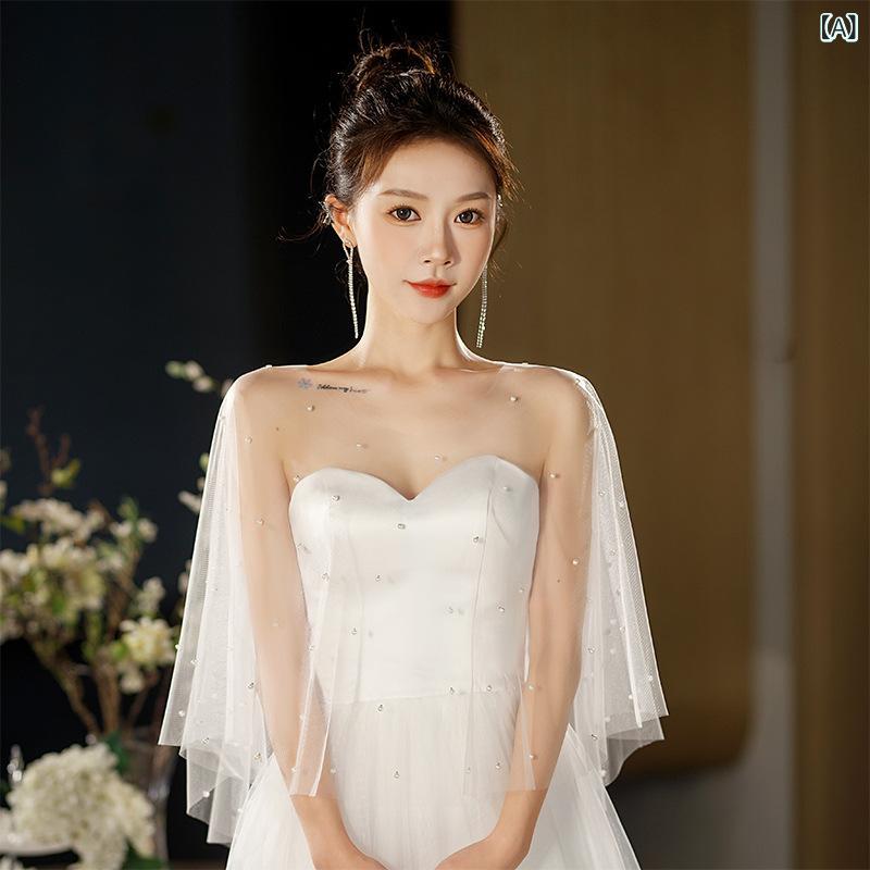 ・性別: 女性・素材: 紗・カラー: ホワイト・スタイル: フェミニン・サイズ: 肩幅45cm以内・編み方: 緯編み・柄: 無地・機能: 装飾・要素: ビーズ・タイプ: プルオーバーケープ