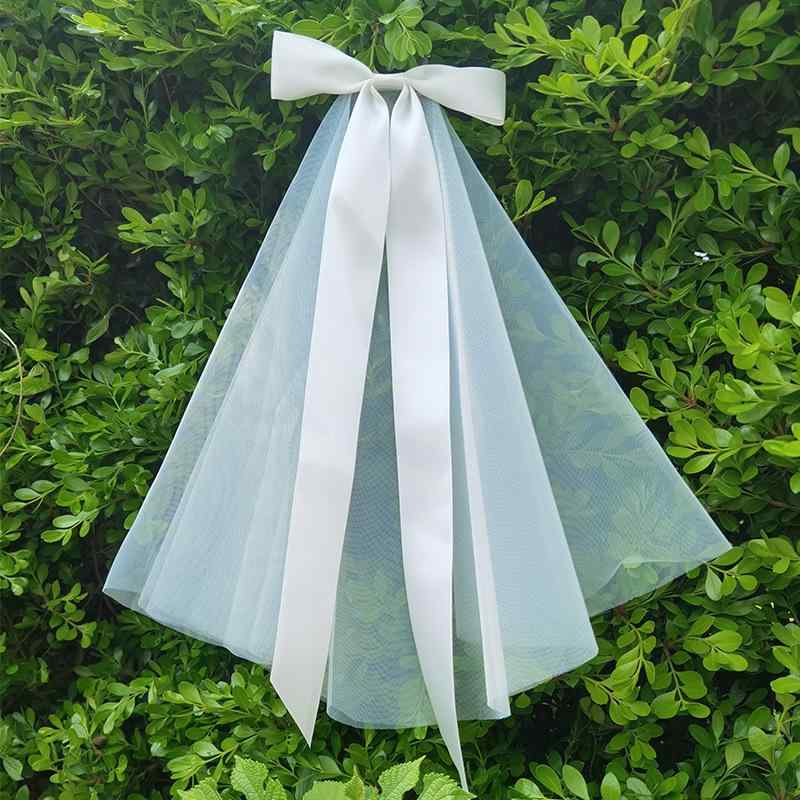 ・カテゴリ: ヘッドドレス・スタイル: シンプル・主な素材: ソフトチュール・タイプ: レディース・: リボン・仕様: 2層式・用途: ウェディング、誕生日、旅行記念・カラー展開: ホワイト・長さ: 約40cm