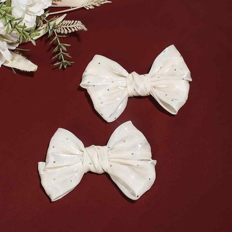 ・カテゴリ: 布製リボン・素材: 布・加工: 手編み・カラー展開: アイボリー、ブラック・柄: トーテム・サイズ: 12.5 × 9 cm