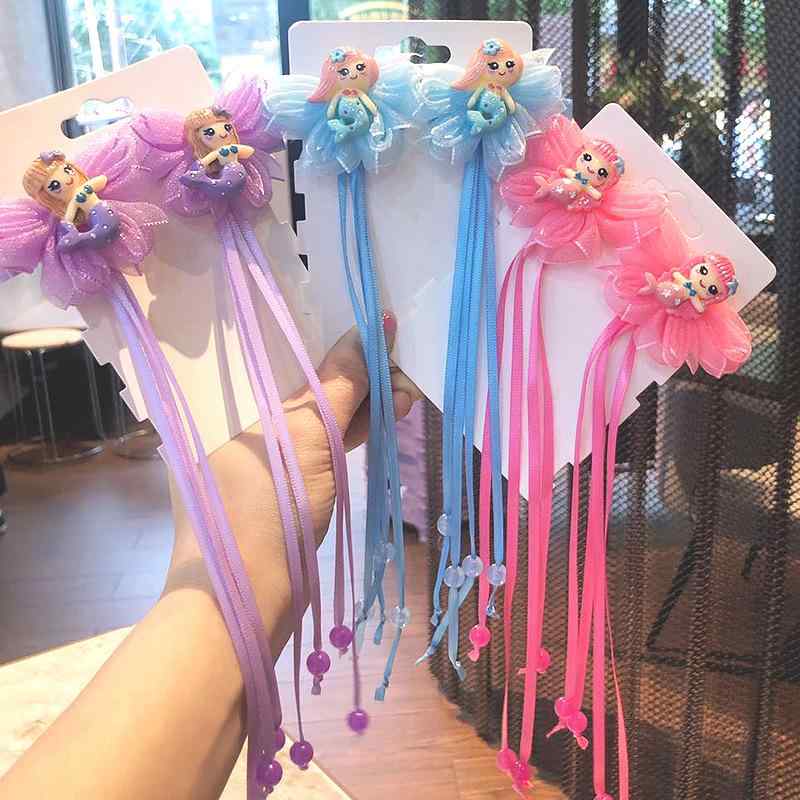 ・カテゴリ: ダッカールクリップ・素材: プラスチック、樹脂・対象: 子供・: 蝶、フリンジ・製法: ハンドメイド・おすすめの場面: 旅行記念・カラー展開: パープル、ブルー、ピンク、ローズレッド