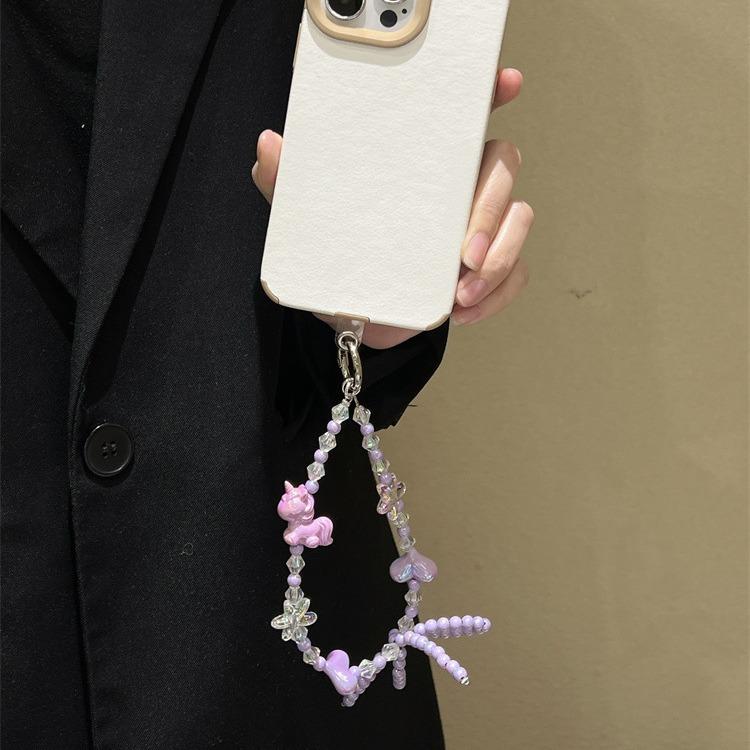 ・カテゴリ: スマホストラップ・スタイル: レディース・ストラップ素材: PP・留め具素材: 金属・: ユニコーン、五芒星、ハート、リボン・カラー展開: パープル、クリームイエロー