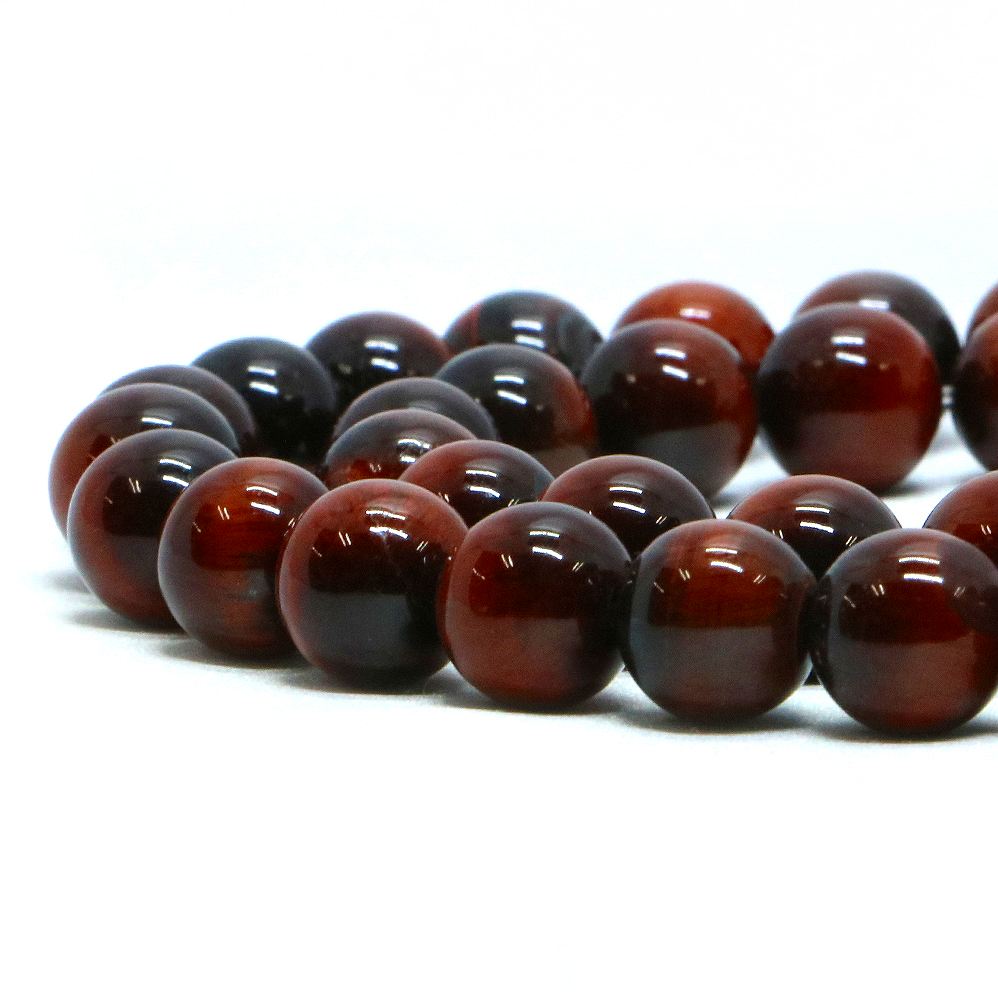 【ビーズサイズ】10mm 【形】丸玉 【連の長さ】約38〜40cm ※ビーズサイズは0.5mm前後の誤差がある場合がございます 【商品説明】 パワーストーンの代表格ともいえるタイガーアイとなります レッドタイガーアイは和名で赤虎目石（あかと...