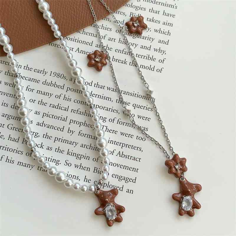 ・カテゴリ: ネックレス・素材: 金属・スタイル: 韓国風・スタイル分類: フレッシュスイート・デザイン要素: クマ・デザインモチーフ: 動物・カラー展開: パール、チェーン