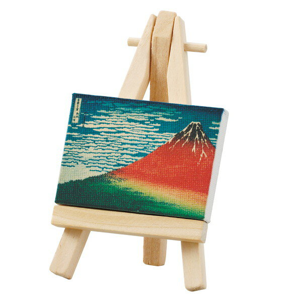 和の名作を、手のひらサイズで楽しむ！ 葛飾北斎の代表作「凱風快晴（赤富士）」をモチーフにした、卓上サイズのミニキャンバスです。 力強くそびえる赤富士の姿が、空間に前向きで明るい印象を与え、日本の縁起モチーフとしても親しまれています。 付属の...
