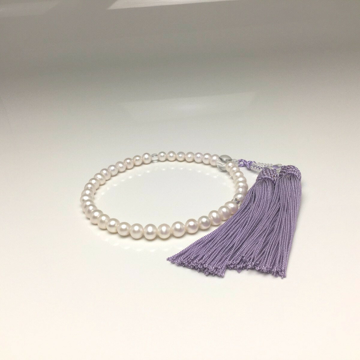 商品の種類念珠（数珠）真珠の種類淡水真珠真珠のサイズ7.0-7.5mm真珠の形状セミラウンド－ポテト真珠の色ホワイト真珠の巻きA真珠のテリA真珠のキズほぼA金具の材質 人絹房 総重量29.4g保証書付商品説明　大変美しい念珠（数珠）です。色...