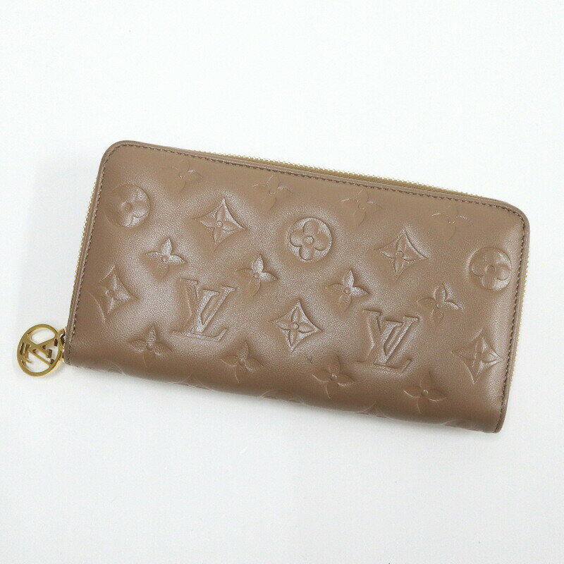 ＞＞同じブランドのアイテムはこちら!! ◆商品ランク ABランク ◆商品情報 ・カラー：トープ(ベージュ系) ・素材/ライン：モノグラムエンボス ・サイズ：W:19.5cm×H:10cm×D:2cm ・仕様：ラウンドファスナー開閉式 札入れ...