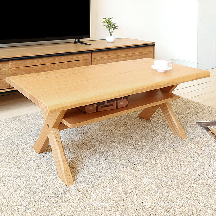 天板を波型にカットしたローテーブル 天板下には収納棚が設けてあり、タブレットやリモコンをさっと片付けられる便利なローテーブルです。 天板の縁は波を打ったような形状にカットしていますので木の自然な雰囲気が好きな方にオススメのテーブルに仕上がっ...