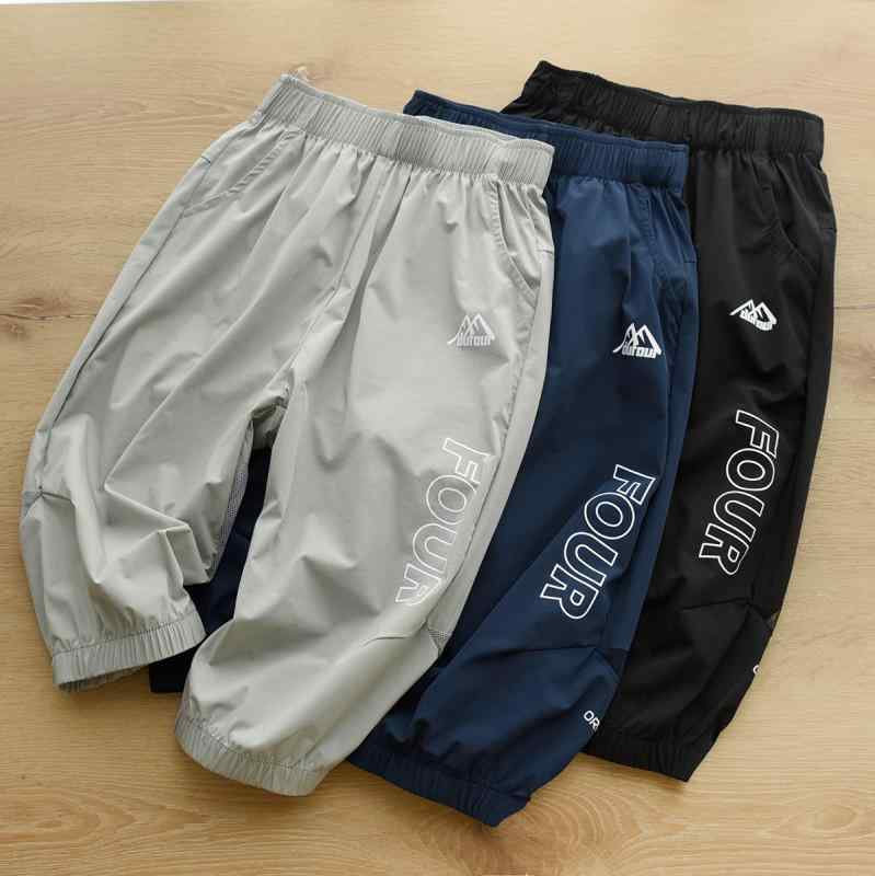 キッズ スポーツパンツ 速乾性 ナイロン 七分丈 カジュアル ズボン 男の子 女の子 子供服 ミドルウエスト ウエストゴム ブラック ネイビー グレー スポーティ 普段着 110cm 120cm 130cm 140cm 150cm 160cm