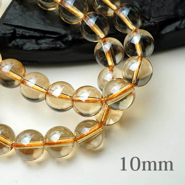 商品情報天然石ゴールデンオーラ（オーラクォーツ）形状ラウンドビーズ(穴あき)粒サイズ約10mm（±0.5mm）通し穴サイズ約1mm前後注意事項※紐で通した連の状態からランダムに選んだ物をお届けさせて頂きます。※天然石の為、一粒ごとに色合いや...