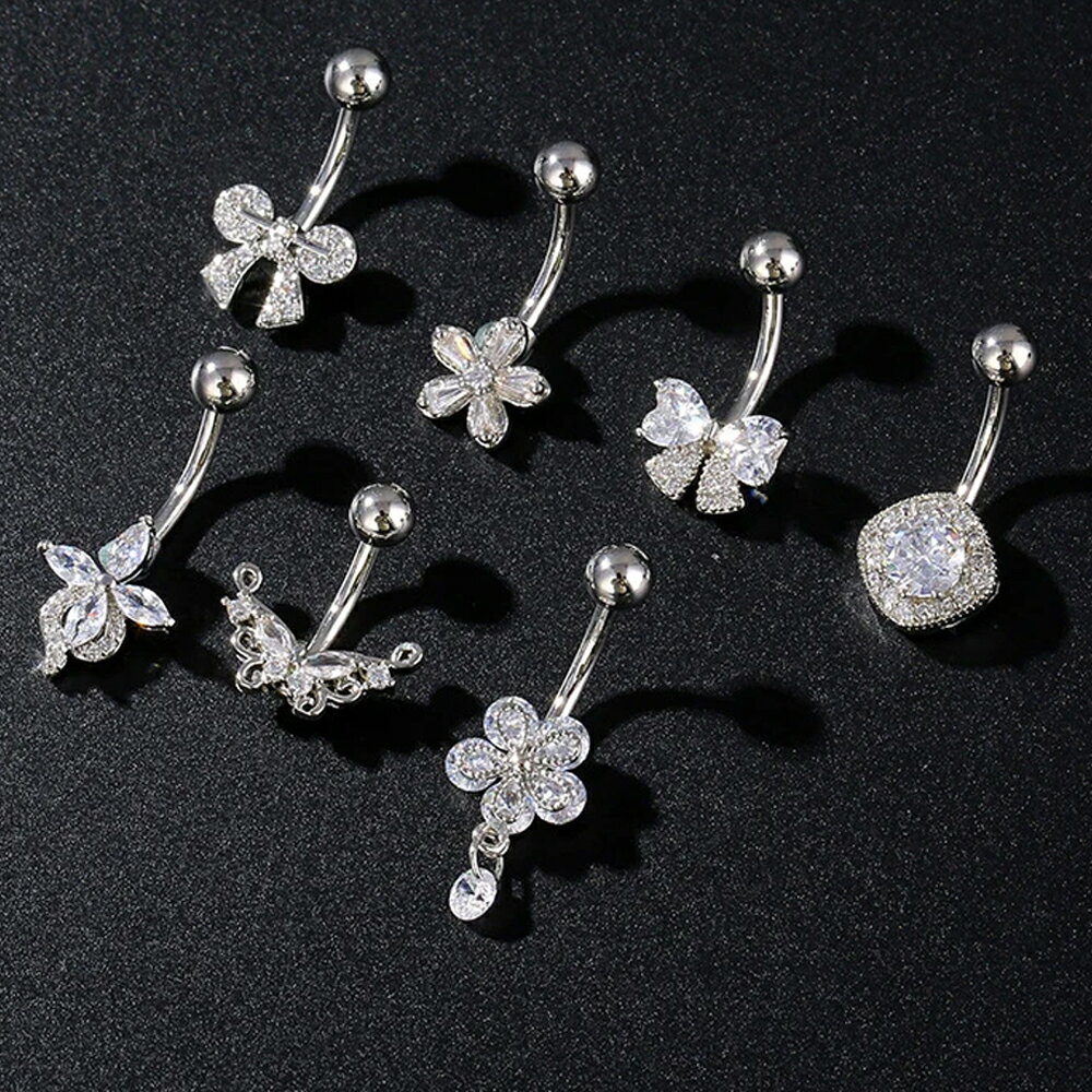 14ゲージのサージカルステンレス316L製のシャフトとボールに蝶や花やリボンをモチーフにしたジュエルヘソピアス。 サージカルステンレス316Lは耐久性と安全性を兼ね備えていると言われています。クリスタルとキュービックジルコニアが美しく輝き、...