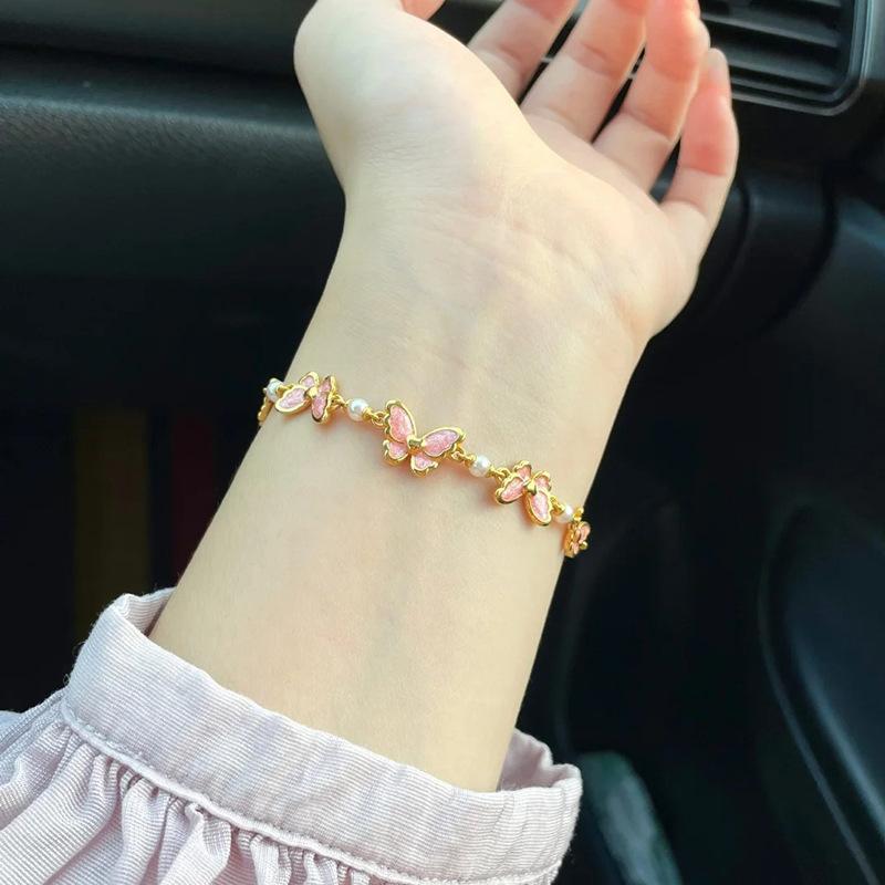 ・カテゴリ: 手飾・スタイル: ファッション通勤、シンプル・主な素材: 銅メッキ・デザイン: 花、リボン、蝶・カラー展開: エナメルカラーバタフライパールブレスレット・対象: レディース・デザイン要素: 蝶、動物