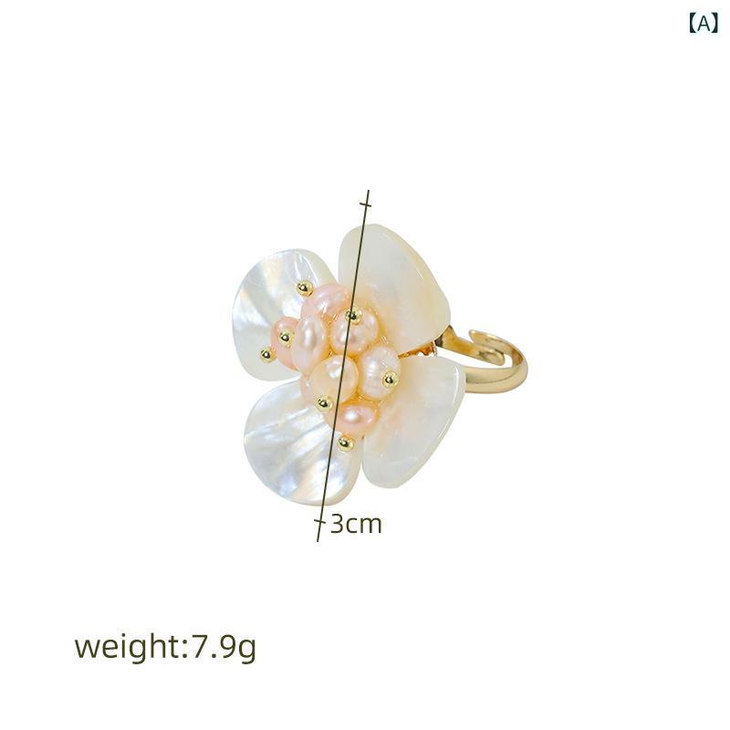 ・カテゴリ: リング・対象: レディース・スタイル: 高級感、ファッション通勤・主な素材: チタン鋼・モチーフ: 花・デザイン: 幾何学模様・加工: メッキ加工・カラー: ピンク・特徴: パール、自然・サイズ: フリーサイズ