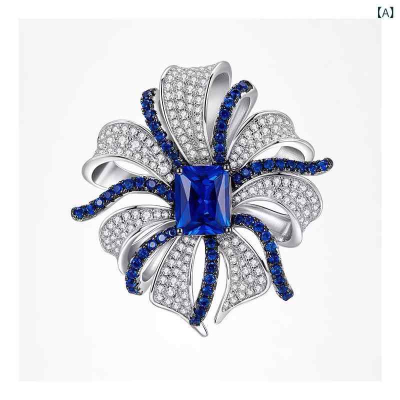 ・素材: 銅・デザイン: 蝶・モチーフ: 蝶結び・加工方法: メッキ加工・カラー展開: サファイア、エメラルド、トルマリンレッド、金青花、金赤花・柄: 満天星・機能: 装飾・スタイル: 高級感・対象: 男女兼用・種類: ブローチ