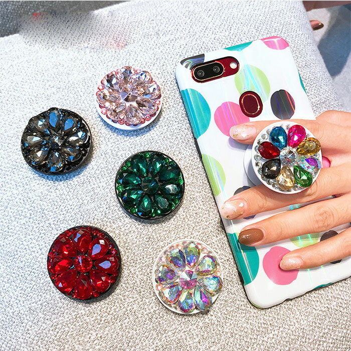 円の直径:3.9cm ※貼り付けの際はスタンドを伸縮後位置確認後に貼り付けてください。 ※スマートフォン本体もしくはケースの汚れを落として貼り付けてください。 ※デコボコケースには貼り付けできません。 ※カラフル色はストーンの配置及び色はラ...