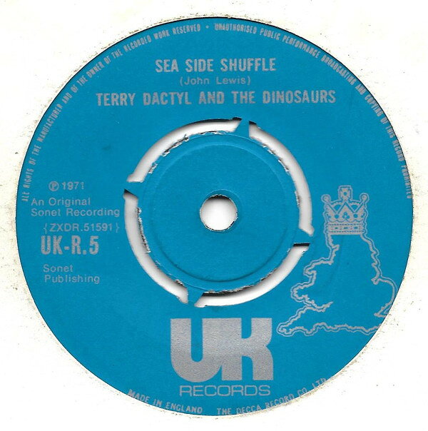 ・アーティスト Terry Dactyl & The Dinosaurs ・タイトル Sea Side Shuffle ・レーベル・型番 UK Records UKR5 ・フォーマット 7インチレコード ・コンディション(盤) 良い (VG...