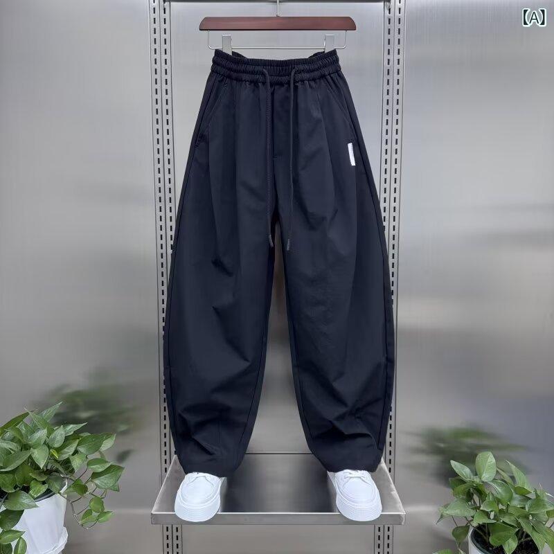 ・スタイル: 青春流行・カテゴリ: 休闲裤・形状: 宽松型・丈: 長丈・ウエスト: 松緊・脚口: 直筒・厚み: 薄手・主な素材: 聚乙烯纤维（乙纶）100%・使用シーン: 日常・詳細: 拼接・ストレッチ: 無・カラー展開: 黒色、米灰色・サ...