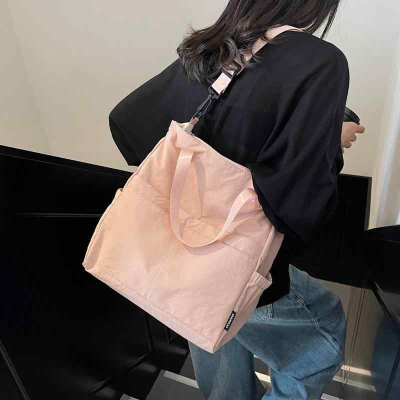 ・スタイル: 都市簡約・主な素材: 布・カテゴリ: トートバッグ・サイズ: 中・流行要素: 車縫線・形状: 横型方形・開閉方式: 拉鏈・内部構造: 証件袋・硬さ: 軟質・外袋種類: 内貼袋・肩帶本數: 雙根・裏地素材: ポリエステル・カラー...