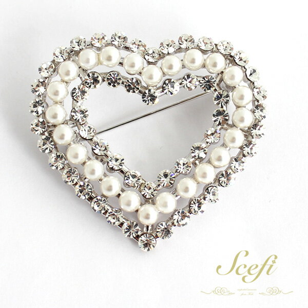 【※】大変申し訳ございませんが、当店ではお客様ご都合による商品交換・返品はお受けしておりません。 パールとラインストーンの組み合わせがかわいいハート形ブローチです。シンプルなハートデザインに贅沢なラインストーン使いできらめきます。胸元はもち...