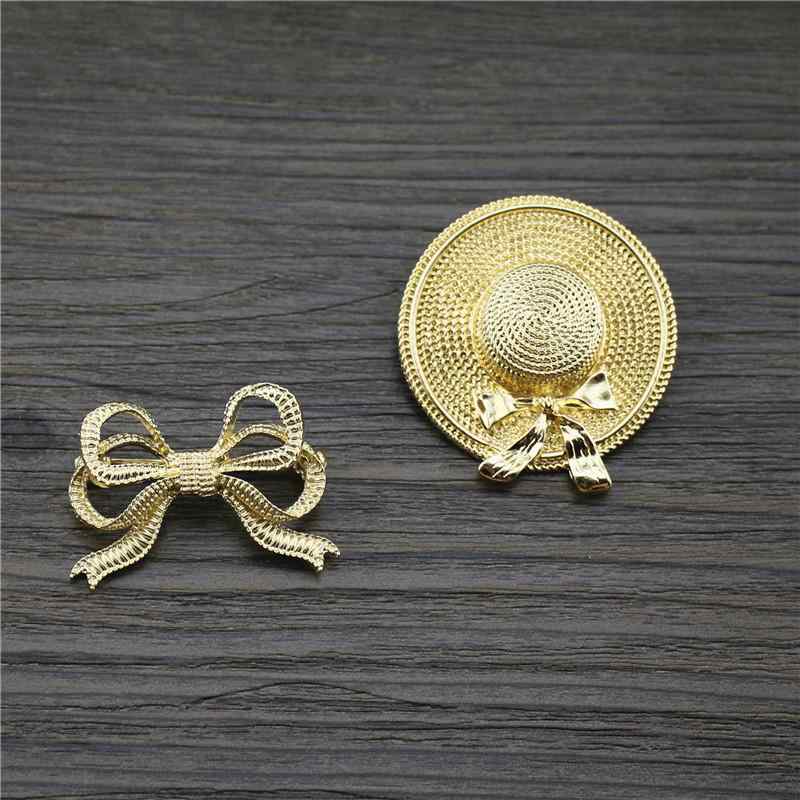 ・素材: 合金・スタイル: 男女兼用・モチーフ: 王冠・加工: 金メッキ・カラー展開: 帽子、蝶ネクタイ・カテゴリ: ブローチ