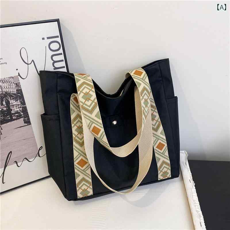 ・カラー展開: ブラック、ホワイト・スタイル: ストリートトレンド・素材: キャンバス・バッグのサイズ: 大・利用シーン: 日常使い・デザイン要素: 縫い糸、カラーブロック・裏地素材: ポリエステル・バッグの形状: 横型スクエア・開閉方法:...