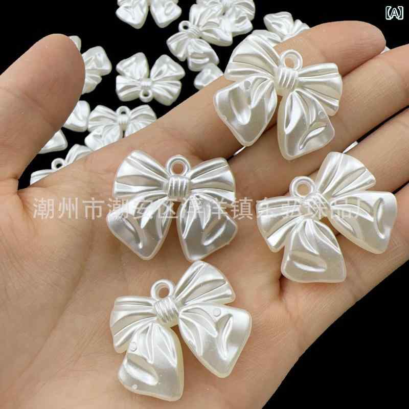 ・種類: DIYアクセサリー・素材: プラスチック/樹脂・処理: 珠光処理・カラー: 米白吊孔蝴蝶结・サイズ: 24*30mm・モデル: 24*30mm 孔約2.2mm（約200個/斤）・柄: 蝶結び、リボン・スタイル: 韓国版・スタイルの...