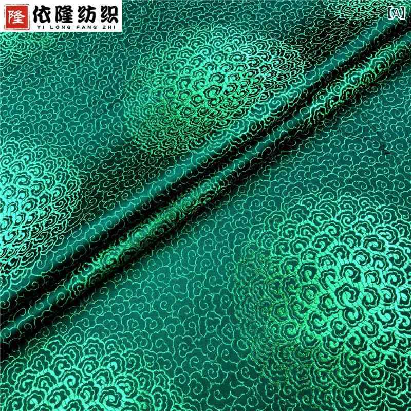 ・種類: 錦緞・主な素材: 高密度ナイロン・糸番手: 300D・密度: 80・重量: 200g/m²・幅: 75cm・仕上げ加工: 染色・柄加工: 絞り染め・プリントスタイル: 細密プリント・流行要素: 民族風・カラー展開: 墨緑ベース、天...