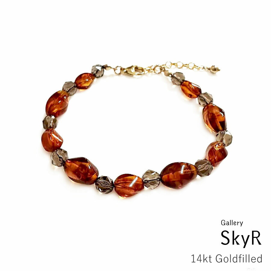 サイズ〔長さ〕最長 約22センチ(アジャスター 約3.5センチ) 〔内周〕約17センチ～20.5センチアンバー(ツイストカット)約6×9ミリ、約8×13ミリスモーキークォーツ(スターカット)約6ミリ金種14ktゴールドフィルド ※ゴールドと...