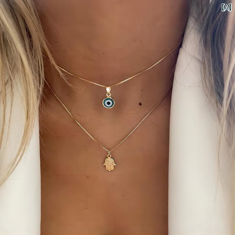 国境を 越えた 欧米の レ トロな 新型の軽 豪華な チェーンは 悪魔の 目の 手のひらの ネックレスの 金色の 2 セットです。材料: 合金処理プロセス: 電気めっきブランド: ハン・ジシャン形状: 幾何学模様商品番号: 5925201出...