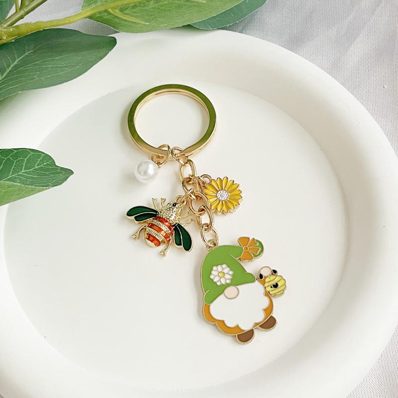 ・素材: 合金・スタイル: オリジナルデザイン・対象: 女性・タイプ: キーホルダー・重量: 15g・柄: 十字架、王冠、ローマ数字・装飾: 蜜蜂