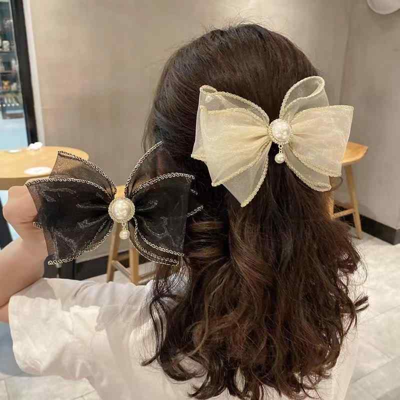 ・カテゴリ: ヘアアクセサリー・主な素材: 布・スタイル: ファッション・通勤・仕様: バレッタ・デザイン: リボン・対象: レディース・カラー展開: ブラック、オフホワイト、シャンパン