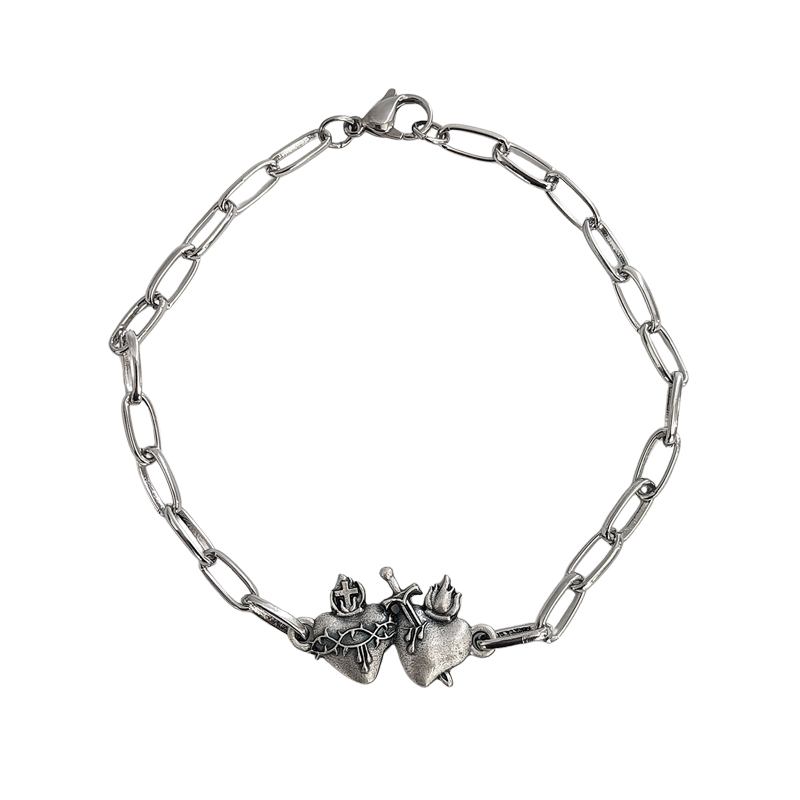 ペアトライバルハート ステンレスチェーンブレスレット シルバー トライバルデザインのペアハートがお洒落なブレスレットです。調節可能なステンレスチェーンタイプ。アレルギーフリーなのでどなたでもご使用いただけます。大切な方へのプレゼントや、ペア...