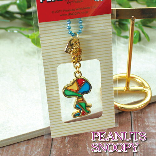 サイズ 全長105mm 材　質 合金、鉄 商品説明 ステンドガラス風のスヌーピー 光との調和でおしゃれに輝きます。 ウッドストックもついてます。