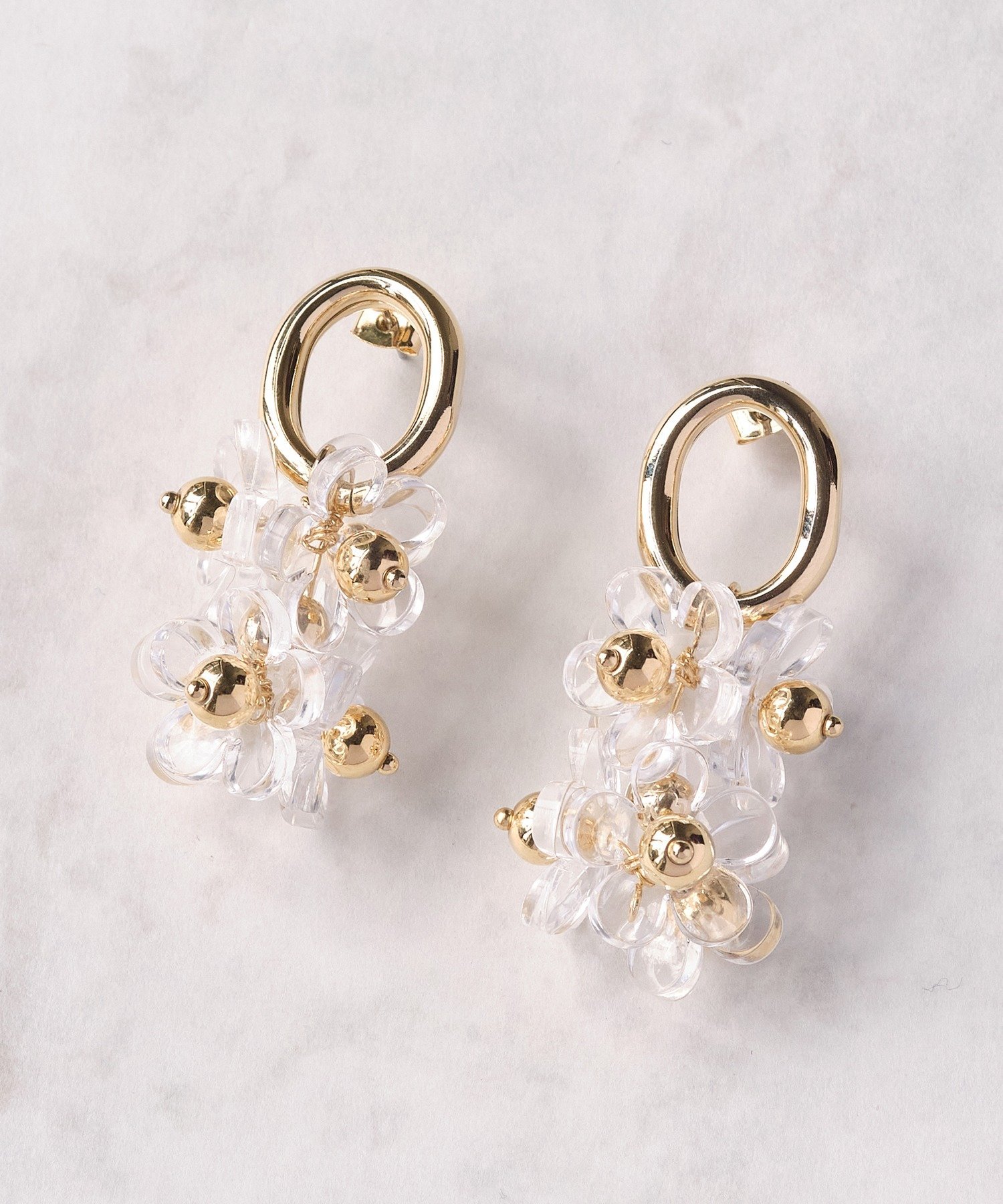 JEWEL ADDICT（ジュエルアディクト）【amplis】poungピアス ゴールド【フラワーデザインピアス】媚びない花シリーズ。プリッとした丸みのあるシルエットが可愛いアイテム。クリア素材の花と、gold、silverのエッジの効いた...