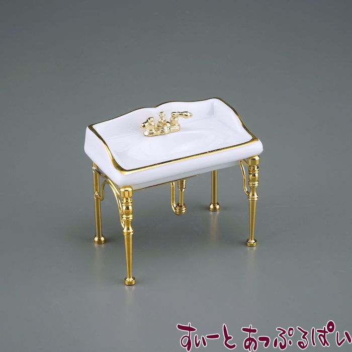 ドイツロイター社製のミニチュアです。朝はこんなキラキラな洗面台で顔を洗って、さわやかな一日をスタートさせたいですね！ドールだって、きっと同じですよ！ぜひあなたのドールハウスに！スケールは1/12です。サイズ：W75xD50xH67ミリ。